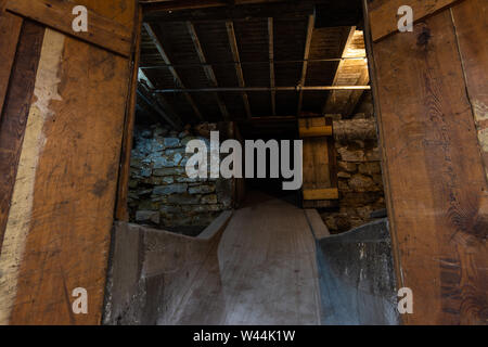 Old concrete loading chute in warehouse basement Stock Photo - Alamy