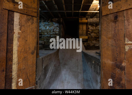 Old concrete loading chute in warehouse basement Stock Photo - Alamy