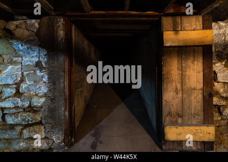 Old concrete loading chute in warehouse basement Stock Photo - Alamy