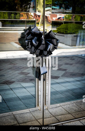 A traditional sign of a death, Big Black Bows of ribbon are tied around ...