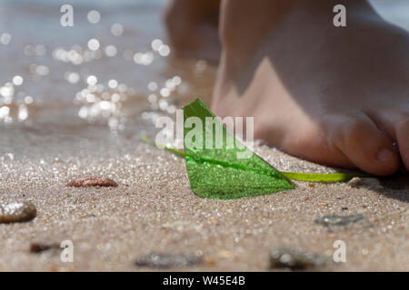 Woman´s foot stepping on broken glass Stock Photo - Alamy