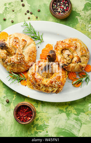 A grill with chicken legs wrapped in bacon Stock Photo - Alamy