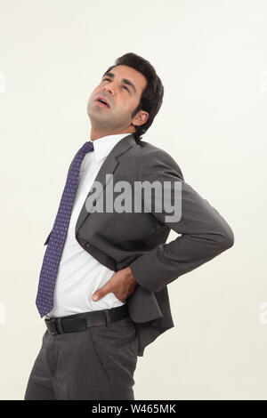 Businessman Suffering From Backpain Stock Photo - Alamy