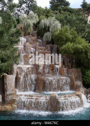 Man-made waterfalls in a landscaped garden Stock Photo - Alamy