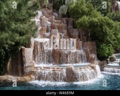 Man-made waterfalls in a landscaped garden Stock Photo - Alamy