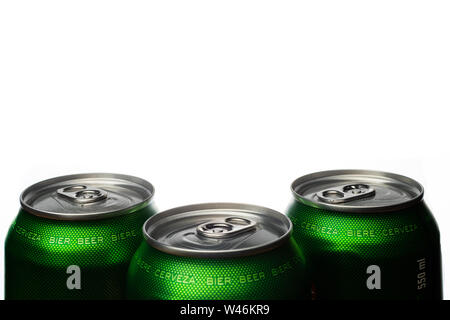 Three green cans of beer. Background for a pub. Beer store. Relax at ...