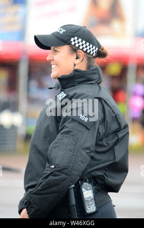 An Authorised Firearms Officer or AFO of the British police holding a ...