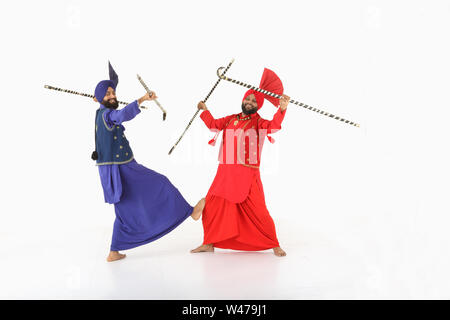 Bhangra dancer holding a stick Stock Photo - Alamy