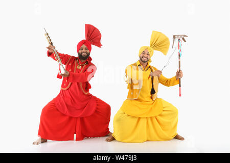 Bhangra dancer holding a stick Stock Photo - Alamy
