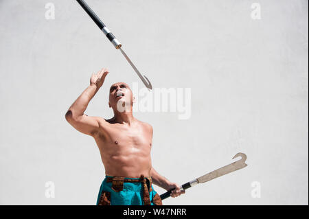 Martial Arts Man with hook swords Stock Photo - Alamy