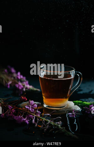 drops of water fall from the tea leaves inside the cup Stock Photo - Alamy