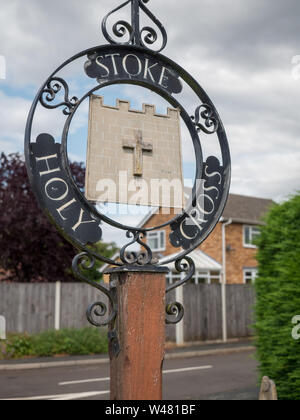 The village sign for Stoke Holy cross village Stock Photo - Alamy