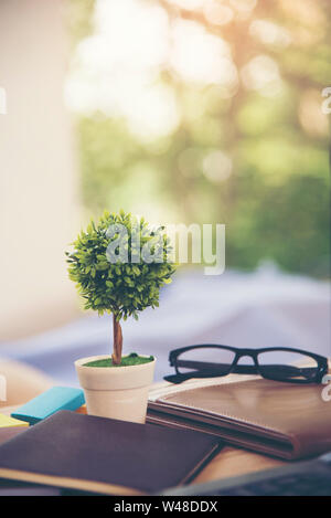 office stuff on a wooden table with office supplies and a cup of coffee ...