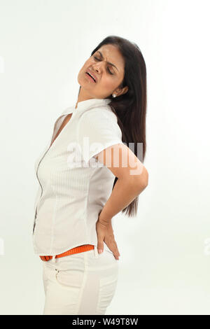 Indian woman suffering from back pain Stock Photo - Alamy