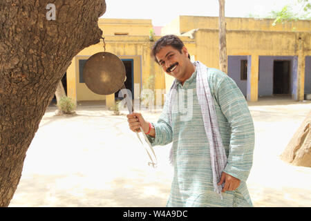 Man ringing bell in school Stock Photo - Alamy