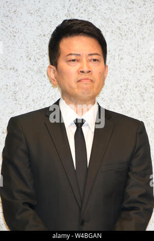 Japanese comedians Hiroyuki Miyasako and Ryo Tamura (unseen) attend a ...
