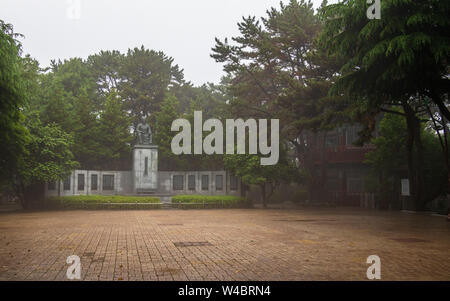 Statue of Choe Chiwon in Dongbaek Park on a foggy day. Central Monument ...