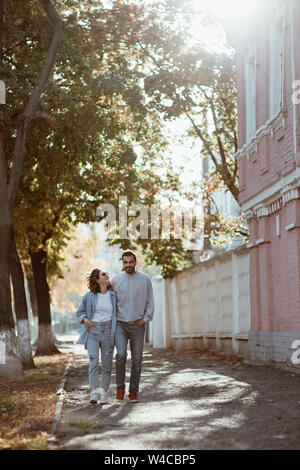 Cute couple in love is holding hands outdoors on a big sunlight Stock ...
