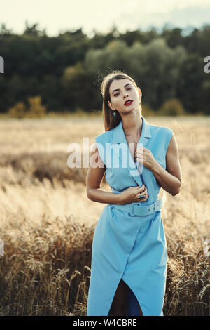People, fashion and nature concept - beautiful young woman standing in ...
