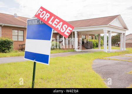 A rundown residential and commercial property in a suburban area with a ...