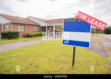 A rundown residential and commercial property in a suburban area with a ...