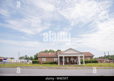 A rundown residential and commercial property in a suburban area with a ...