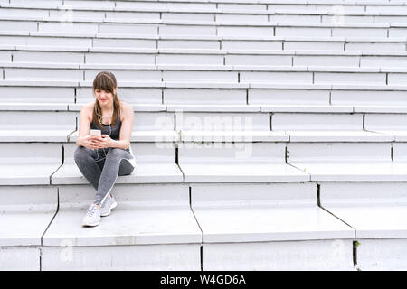 People sitting on bleachers in preparation for the festivities of the ...
