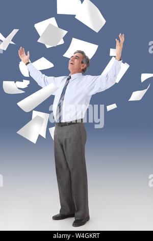 Papers falling on a businessman standing with showing bar graph rising ...