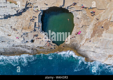 Aerial view of tourists bathing in the Giola, a natural pool on Thassos ...