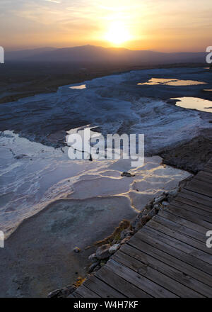 Natural travertine pools and terraces at sunset - Pamukkale, Turkey ...