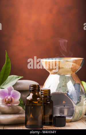 Orchid essential oil in a small bottle. Selective focus. Nature Stock ...