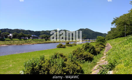 Hinokinai River riverbank in summer sunny day at Town Kakunodate ...