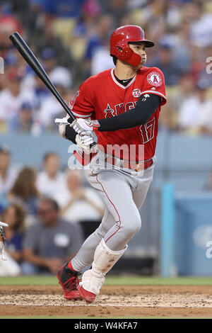 Los Angeles Dodgers' Shohei Ohtani laughs with his strength and ...