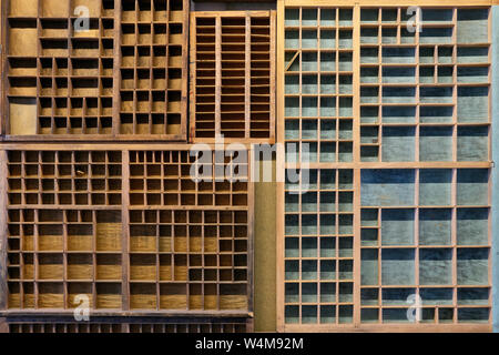 Set case. Close-up of old typesetting boxes on the facade of a paper ...