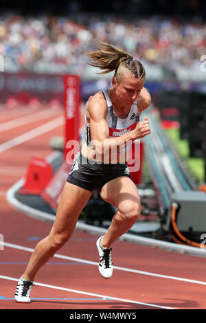 Female athletes at the starting line of a 400m race on track ...