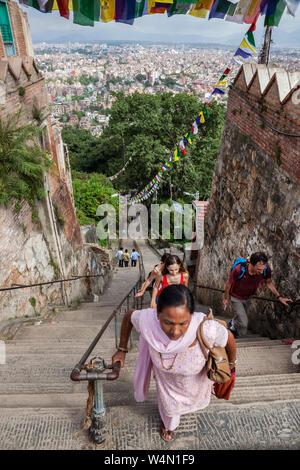 Visitors climb steps to Swayambhunath Temple, in Kathmandu, Nepal ...