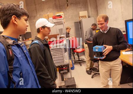 Members of the Johns Hopkins Robotics Club, pose together with a remote ...