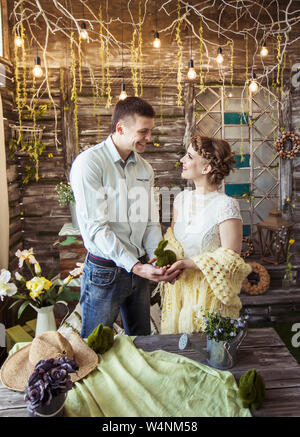 Happy couple holding rabbit in pet sho Stock Photo - Alamy