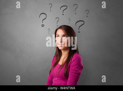 Person with question marks around face Stock Photo - Alamy
