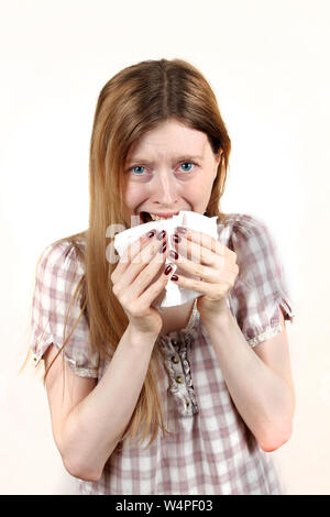 woman with unhappy facial expression holding her head migraine pain ...