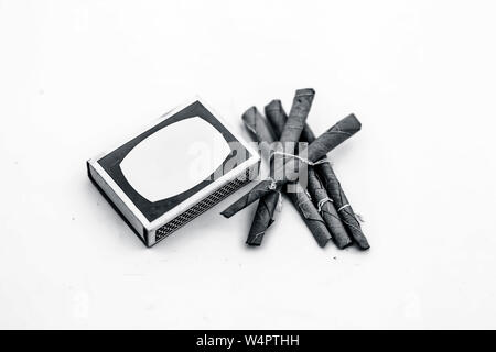 Black and white Bidi and cigarette on brown sack mat background, pack ...