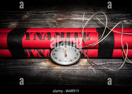 Dynamite bomb with a timer, and a bunch of dynamite on black background ...