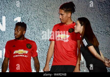 Fred and Chris Smalling of Manchester United takes on Julian Draxler of ...