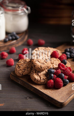 Photo of a homemade chocolate chip cookie isolated on a blue background ...
