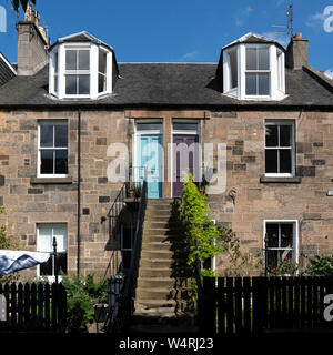 Exterior view of row of Colony style terraced houses in Stockbridge ...