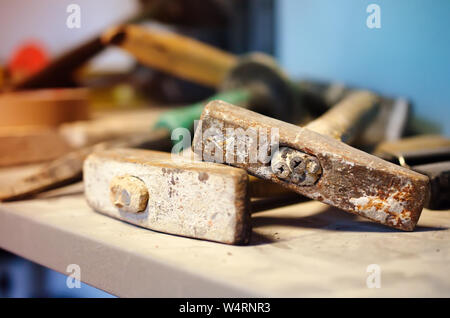 Old destroyed hammers among other hand tools Stock Photo - Alamy