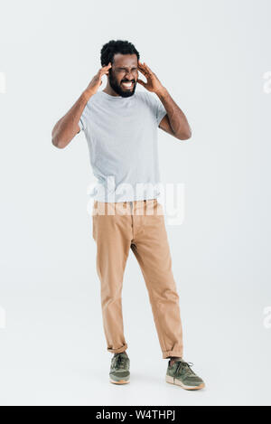 African man having a headache pain and worry Stock Photo - Alamy