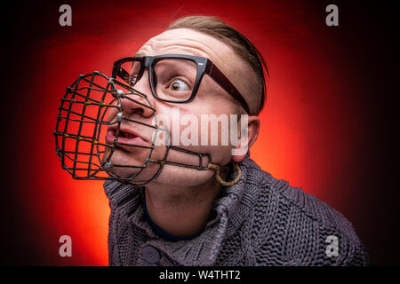 Angry and agressive man with dog muzzle basket shouting Stock Photo - Alamy