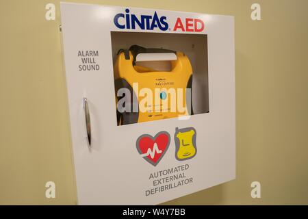 Defibrillator AED on wall in public space for emergency heart ...