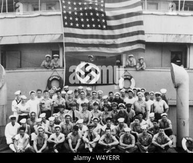 USS Omaha (CL-4) with German blockade runner Odenwald, 6 November 1941 ...